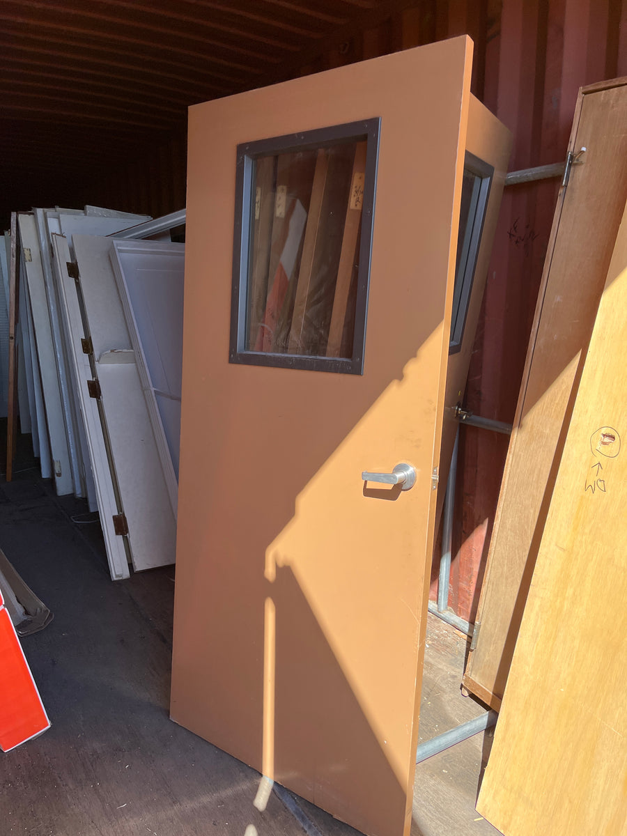 Heavy solid door with window – Gersons Building Materials